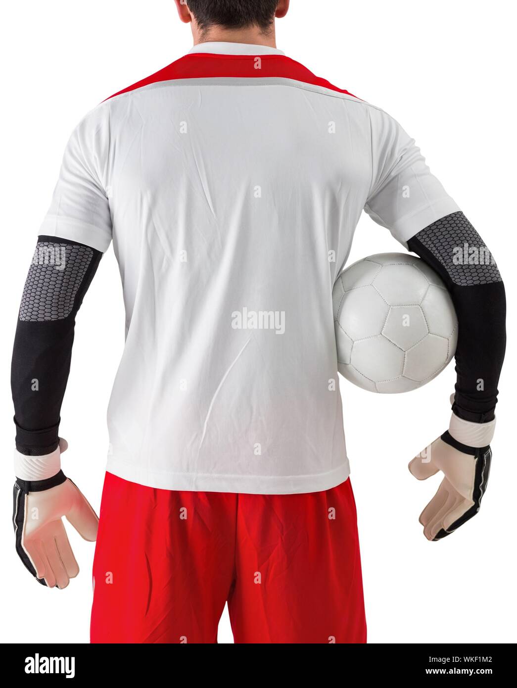 Goalkeeper standing in white jersey on white background Stock Photo - Alamy