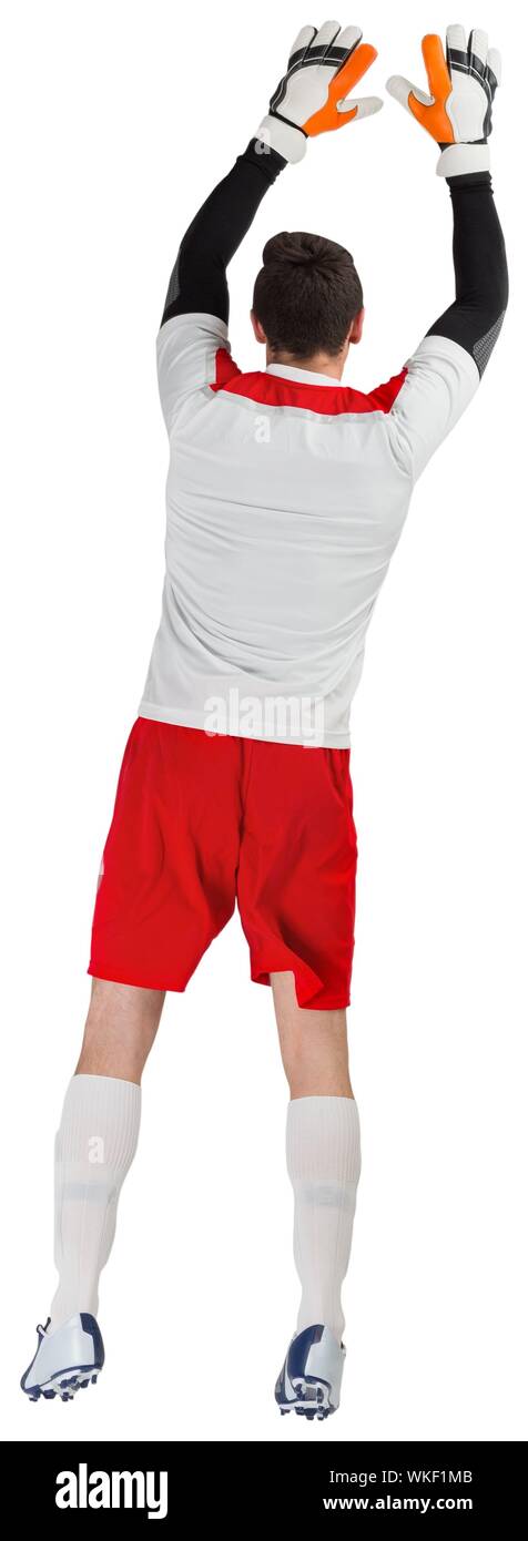 Goalkeeper in white making a save on white background Stock Photo - Alamy