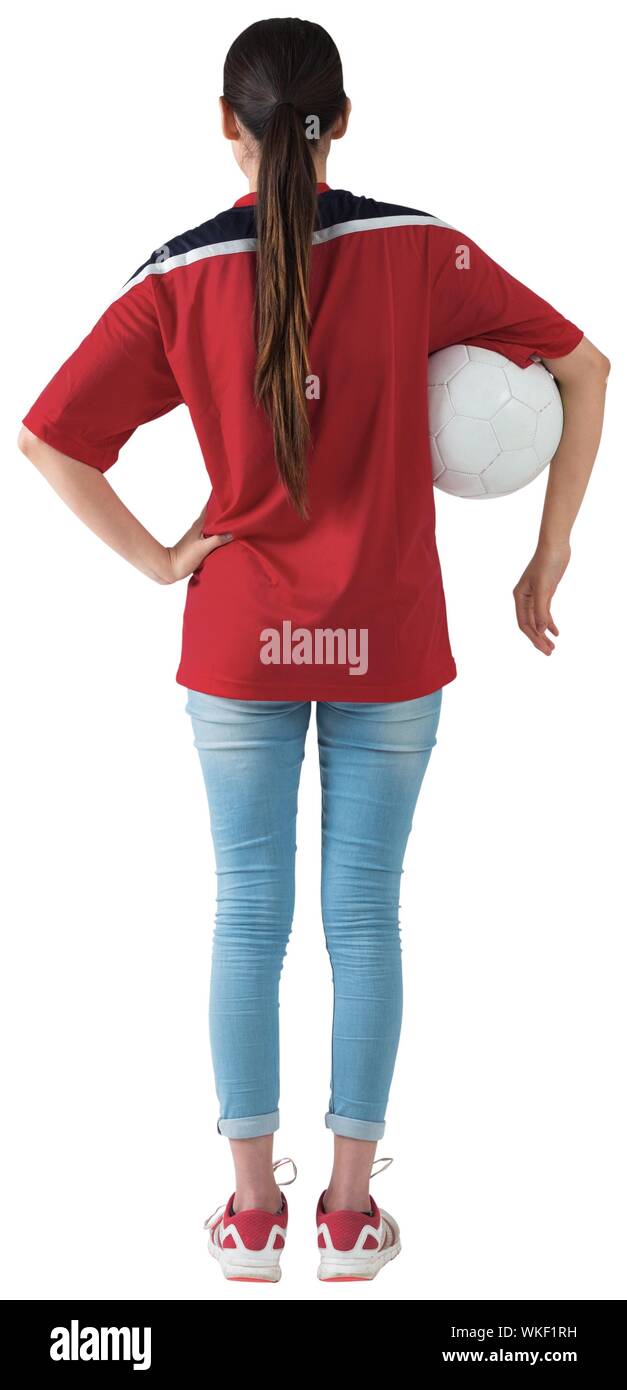 Football fan in red holding ball on white background Stock Photo - Alamy