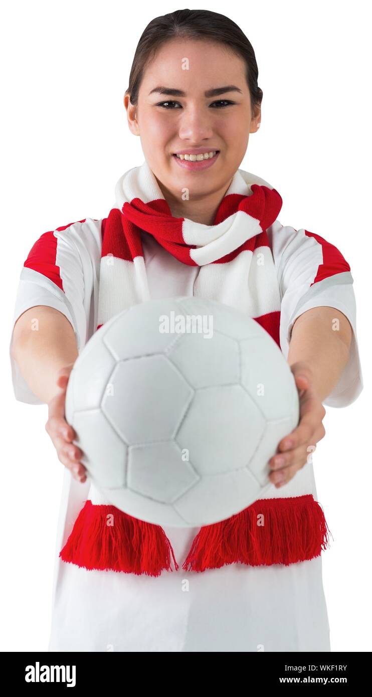 Football fan in white wearing scarf holding ball on white background ...