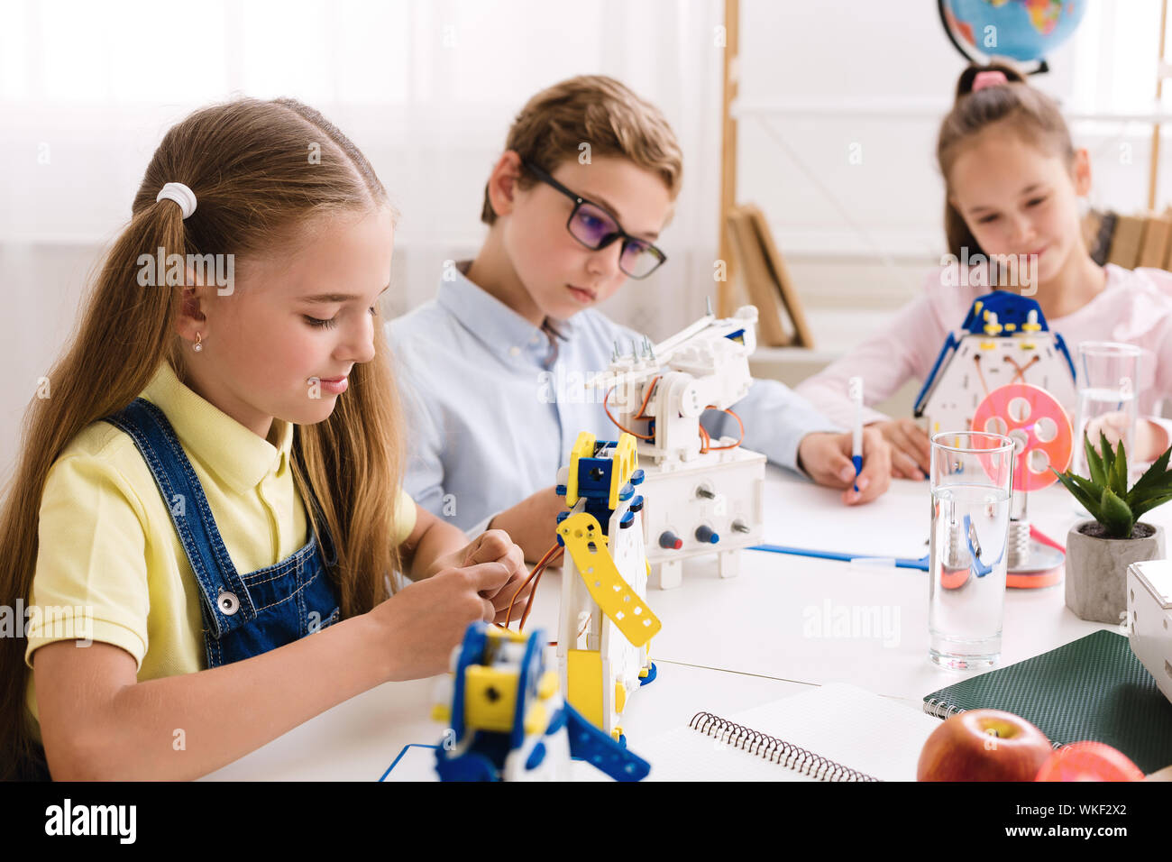 Schoolgirl making diy robot at stem lab Stock Photo - Alamy