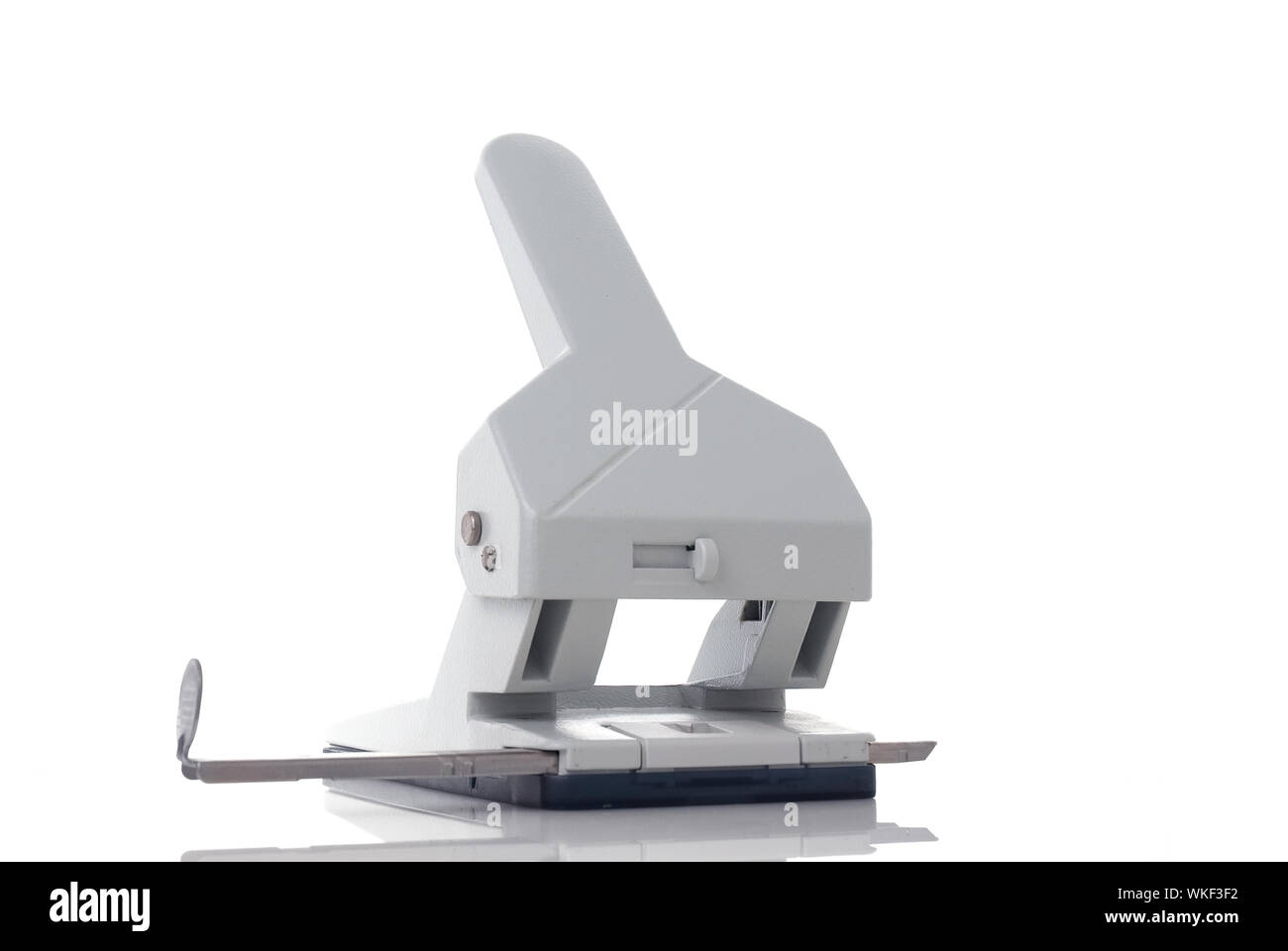 White hole puncher isolated on white background Stock Photo - Alamy