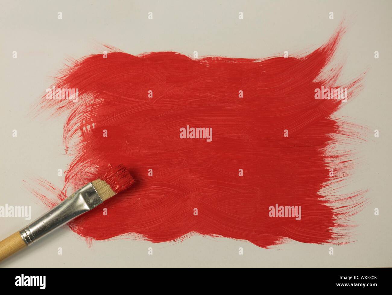 Red paint with paintbrush on white background Stock Photo - Alamy