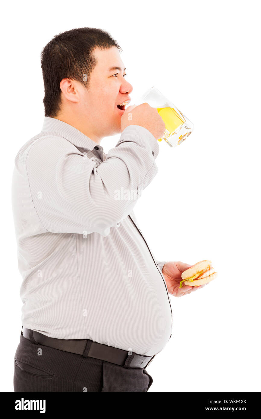 fat business man drinking beer mug and eating hamburger Stock Photo - Alamy