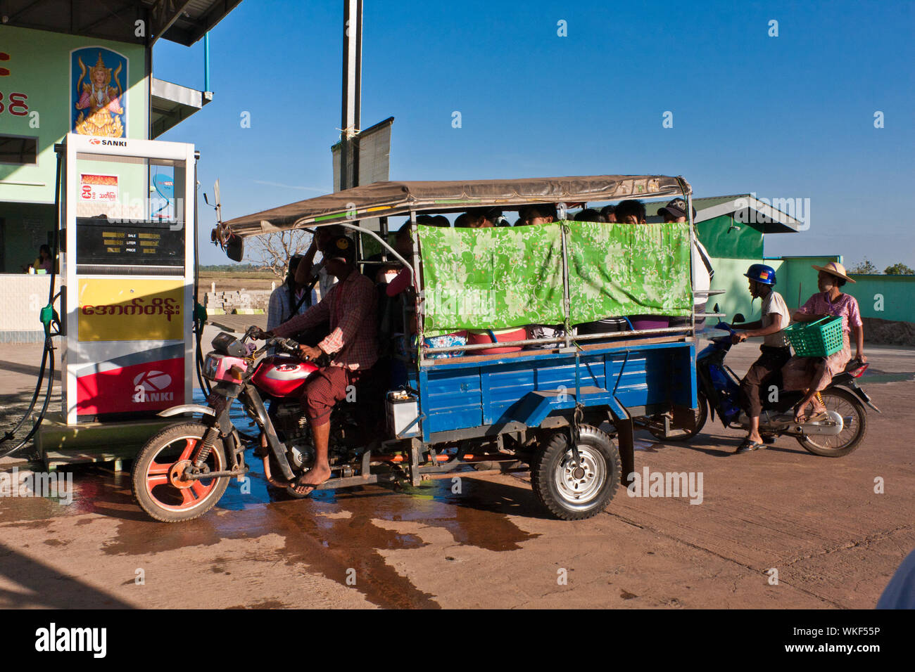 A typical tricycle rickshaw at the petrol station in Myanmar Stock ...