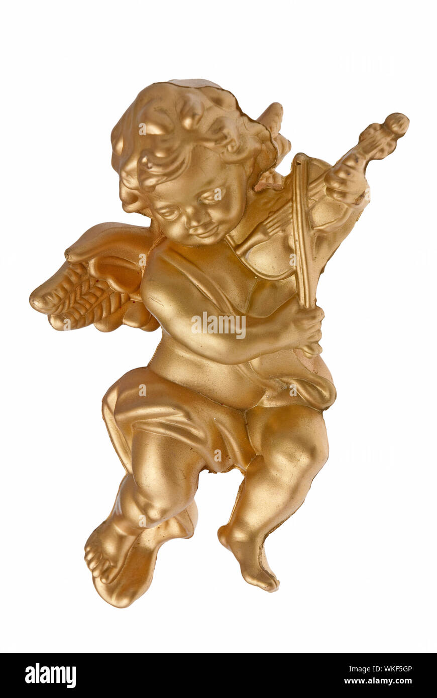 Angel plastic statue of an gold angel playing violin isolated on white ...