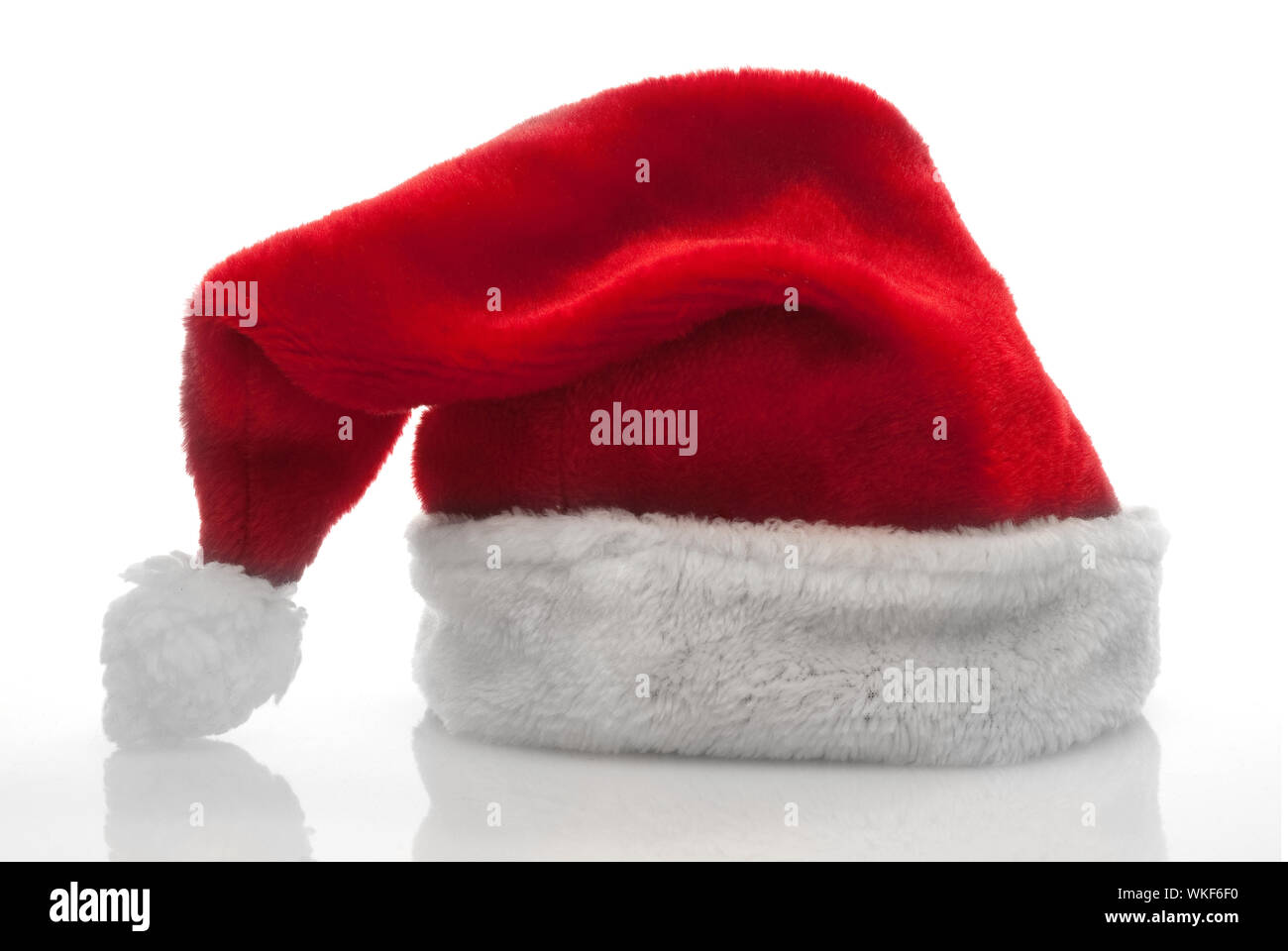 Red santa claus hat on white background Stock Photo - Alamy