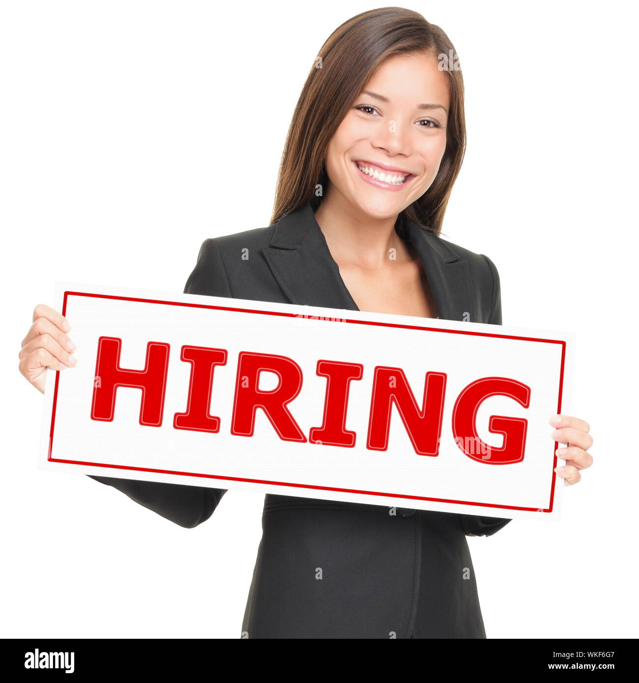 Job woman showing hiring sign. Young smiling Caucasian / Asian ...