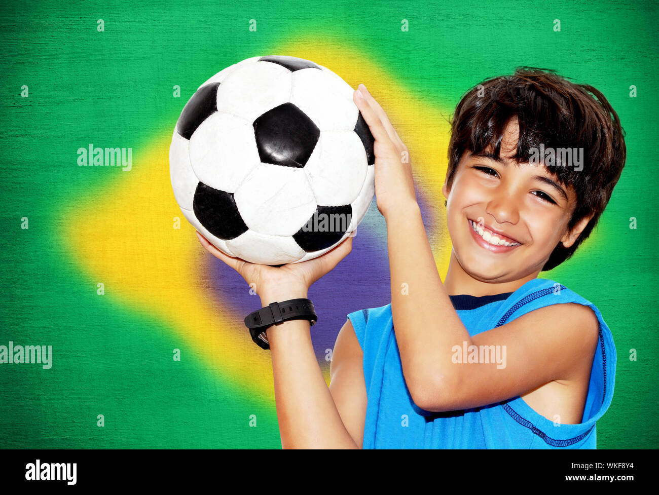 Cute boy playing football, happy child, young male teen goalkeeper ...