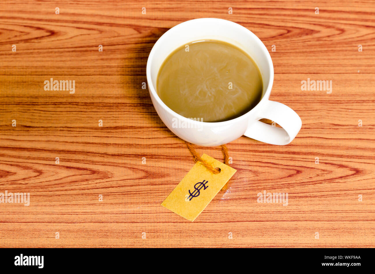 coffee cup with price tag on wood background Stock Photo - Alamy