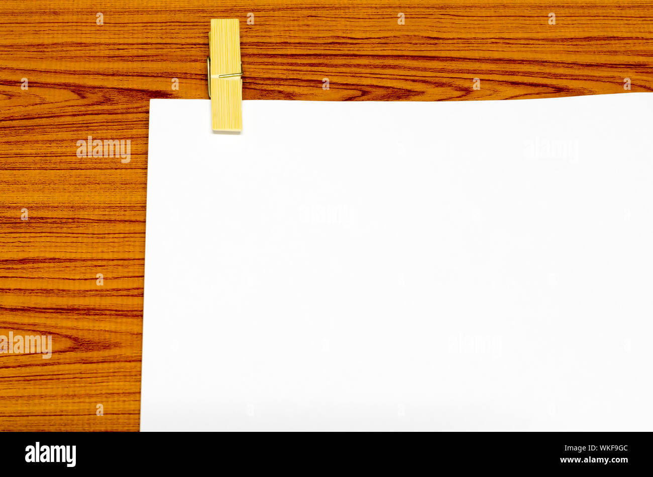 wooden pin paper on wood background Stock Photo - Alamy