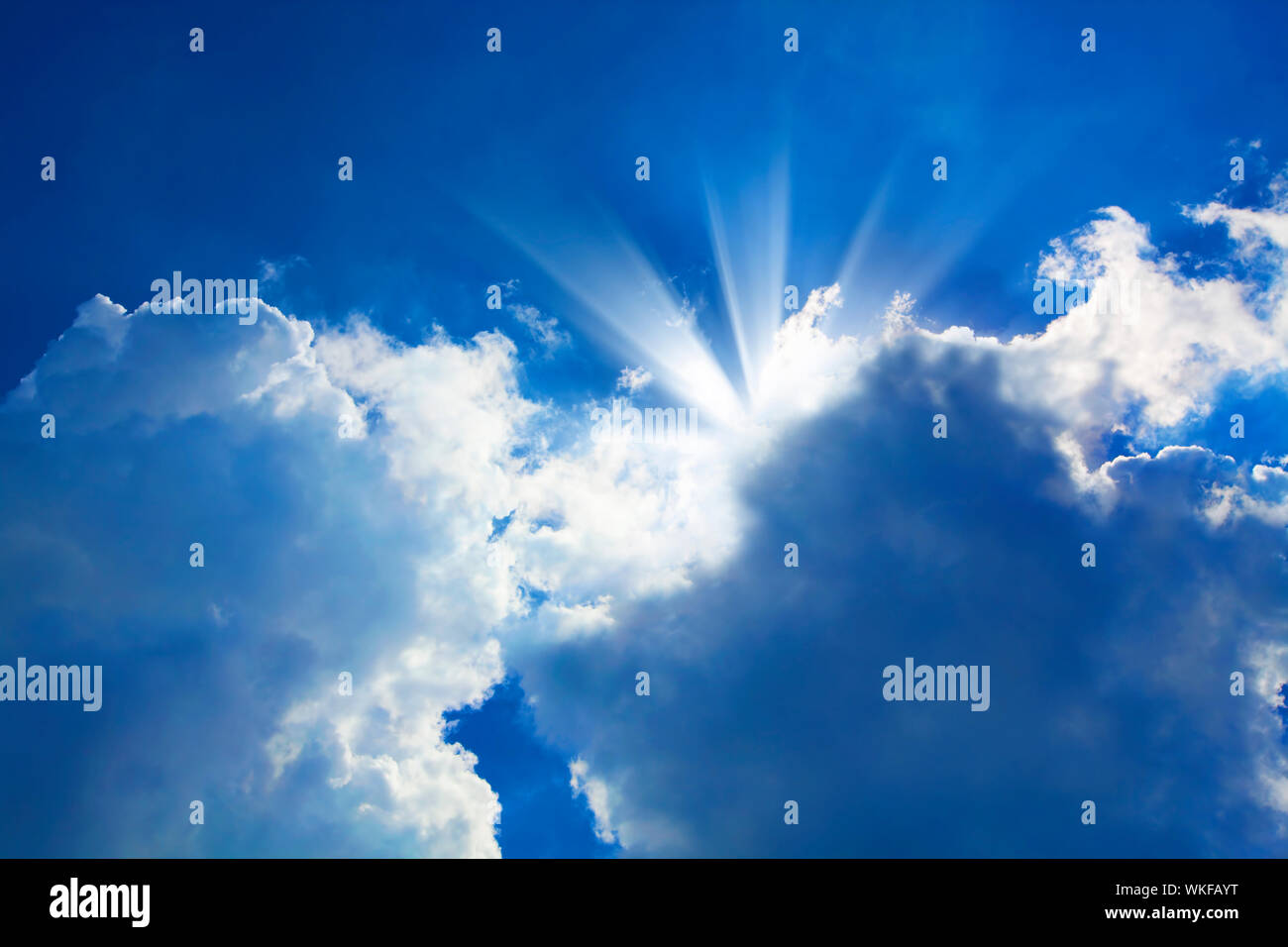 Beautiful blue sky with clouds and sun Stock Photo - Alamy