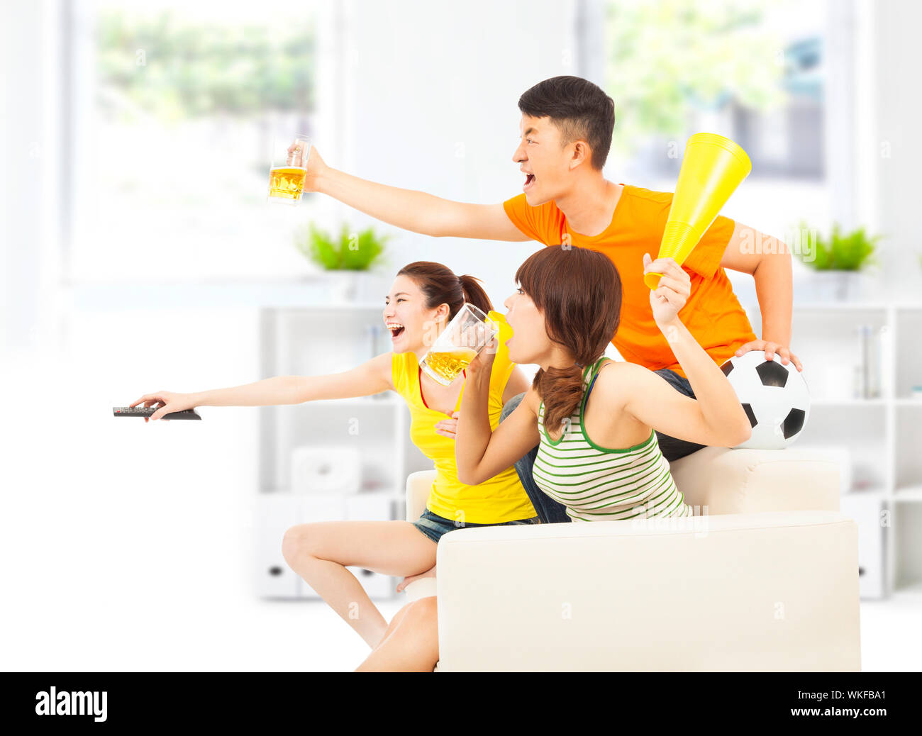 young people so excited to yelling and while watching soccer game Stock ...