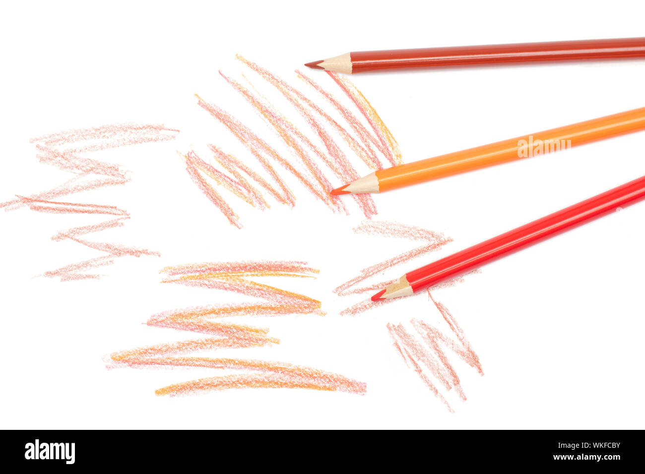 Group of three whole colored pencil with several scratches flatlay ...