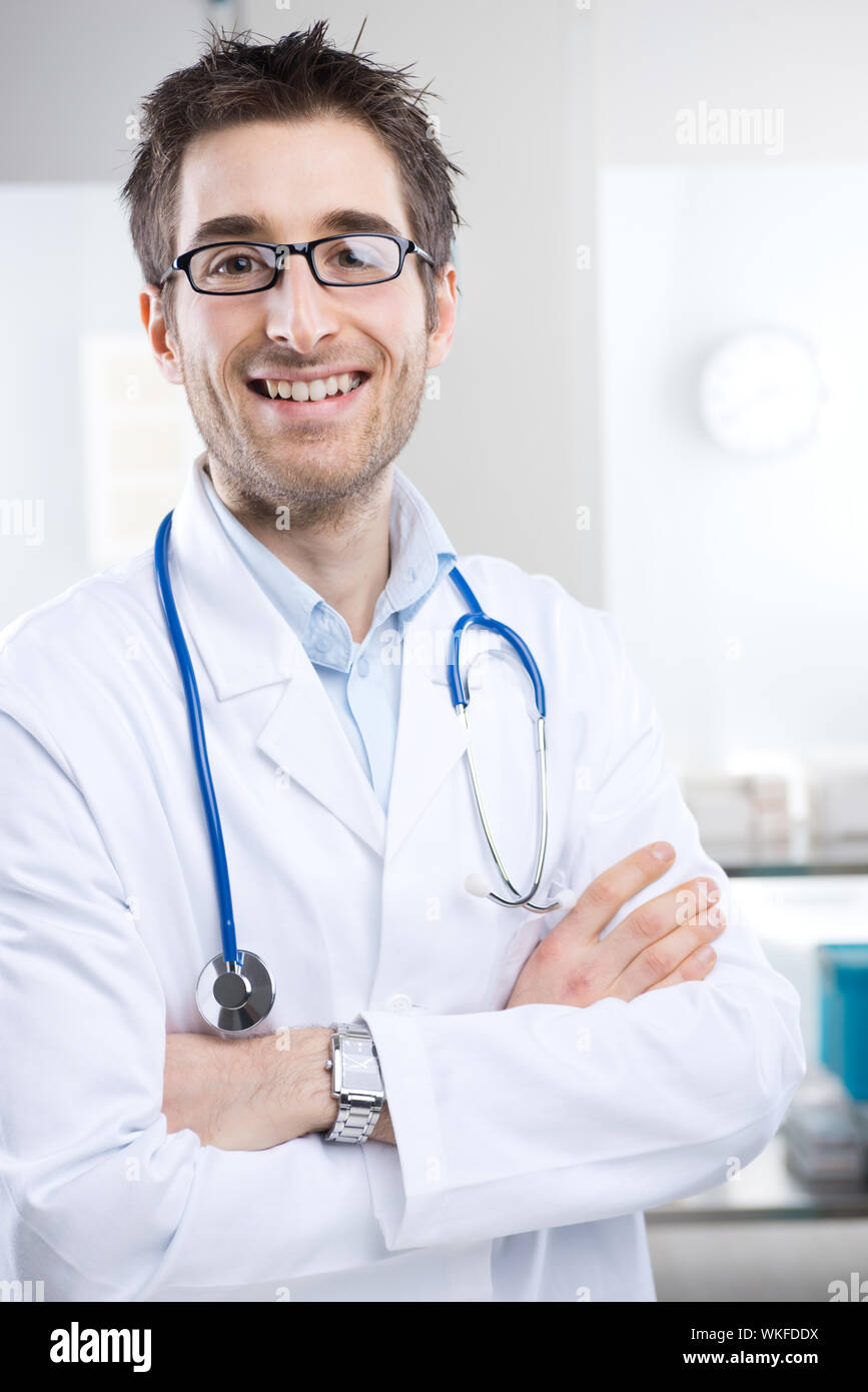 Young professional doctor at hospital with crossed arms Stock Photo - Alamy Young professional doctor at hospital with crossed arms Stock Photo - Alamy