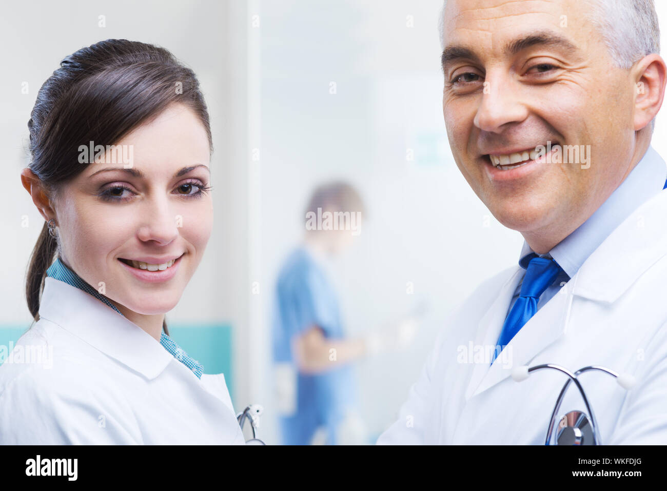 Team of doctor at hospital smiling confidently at camera Stock Photo ...