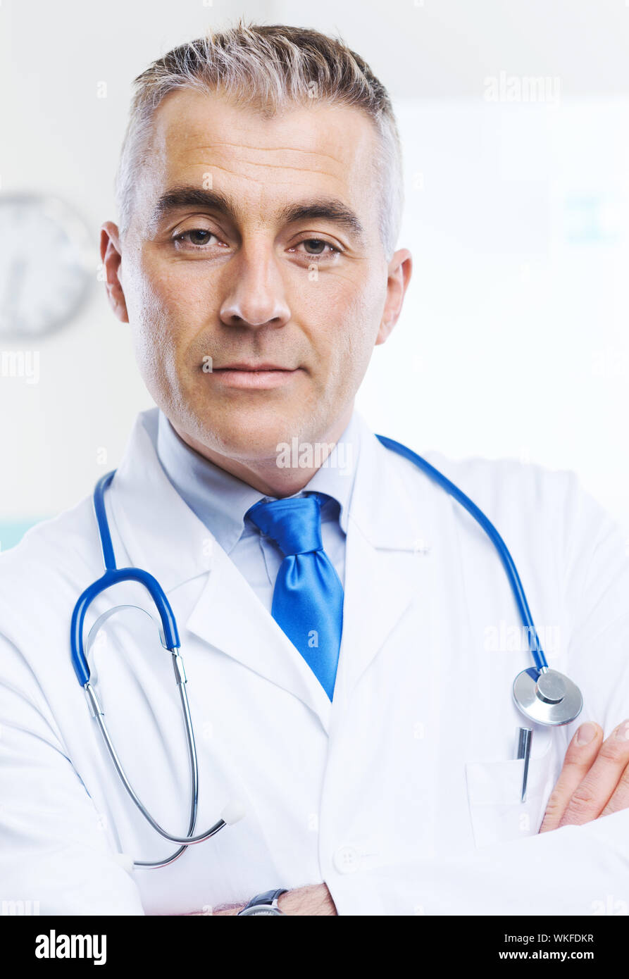 Portrait of an handsome confident doctor with medical equipment Stock ...