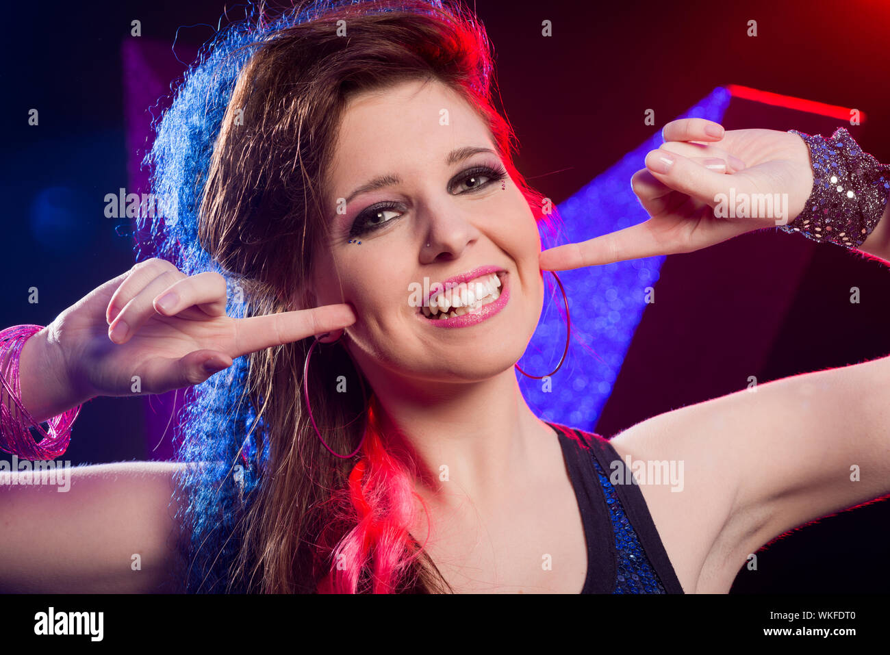 Young attractive singer on stage smiling at camera Stock Photo - Alamy