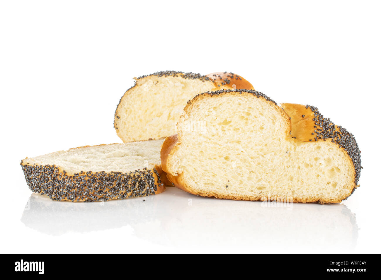 Group of three slices of twisted poppy seed bun isolated on white ...