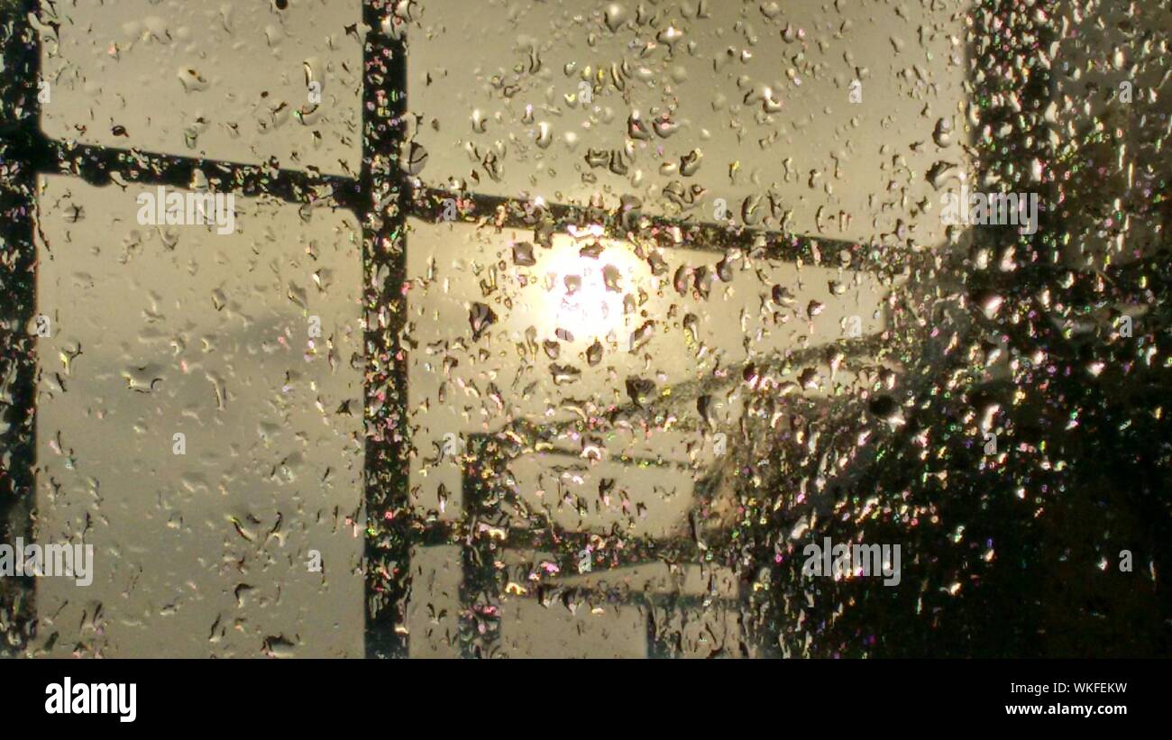 Sun Seen Through Wet Window During Rainy Season Stock Photo - Alamy