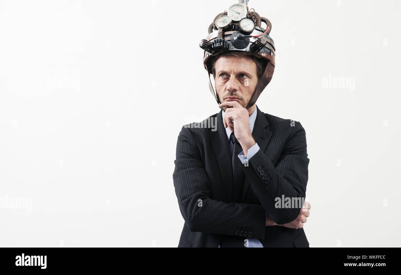 Confident businessman thinking with hand on chin wearing steampunk ...