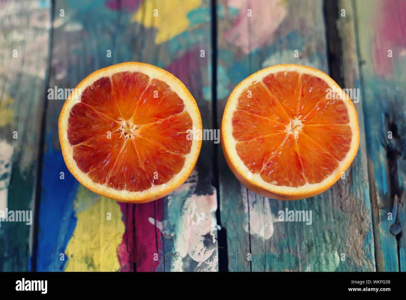 This is a photo of oranges on multi colored background Stock Photo - Alamy