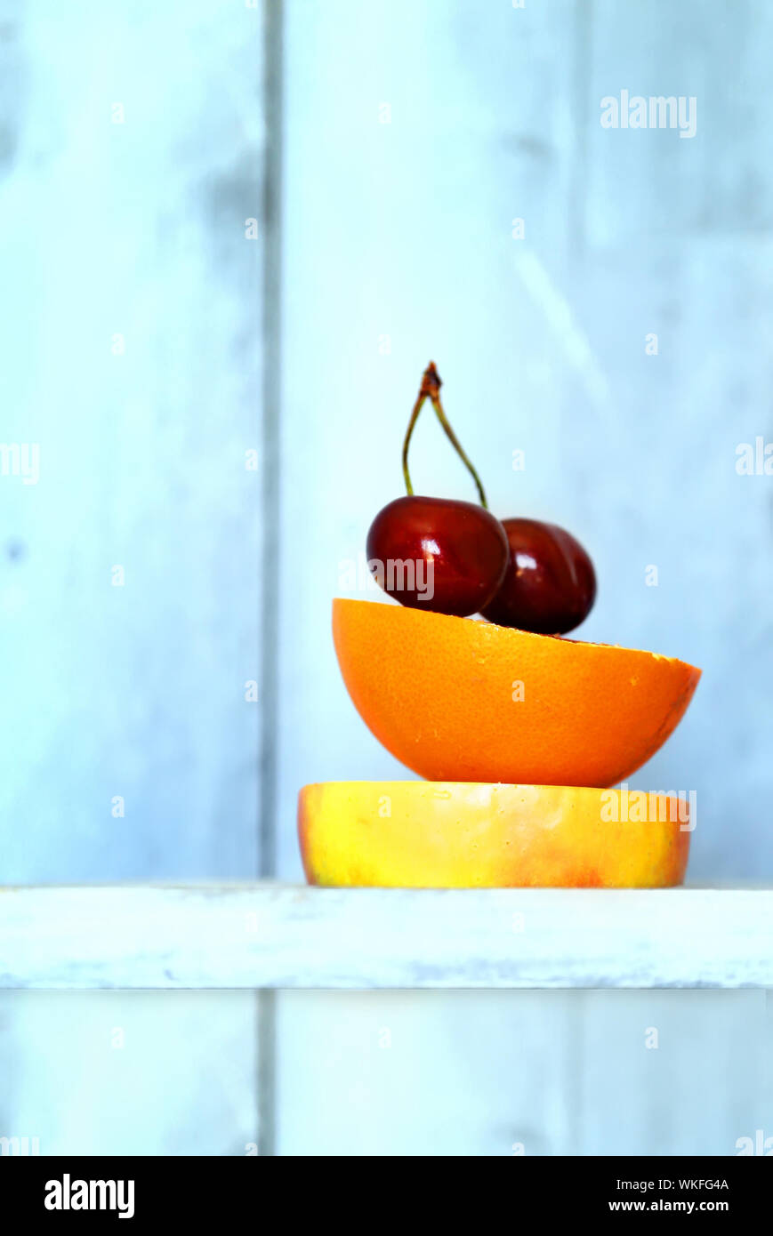 Summer photo of sliced apple, orange and cherry Stock Photo - Alamy