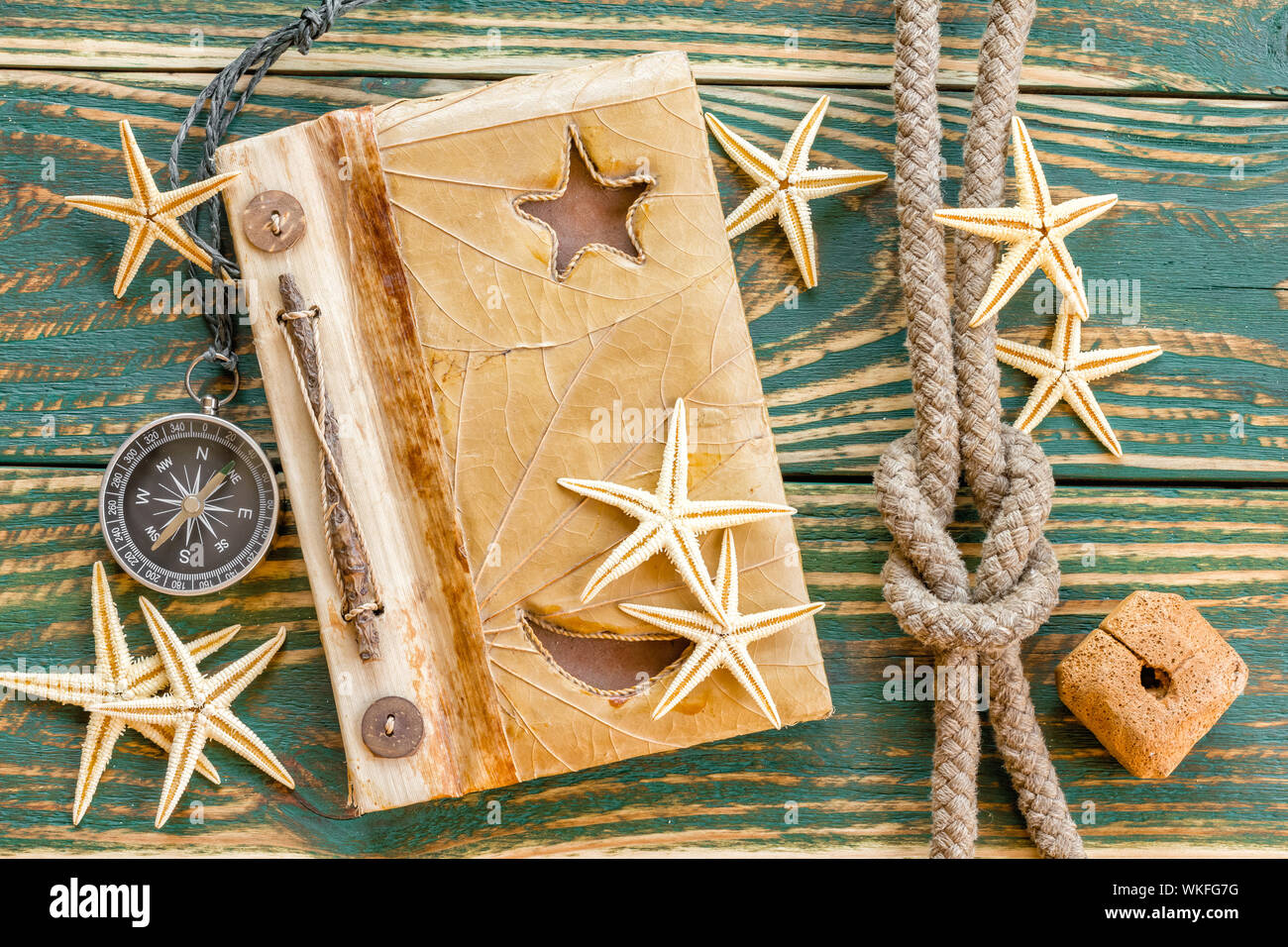Old notepad with seashells on the deck Stock Photo - Alamy