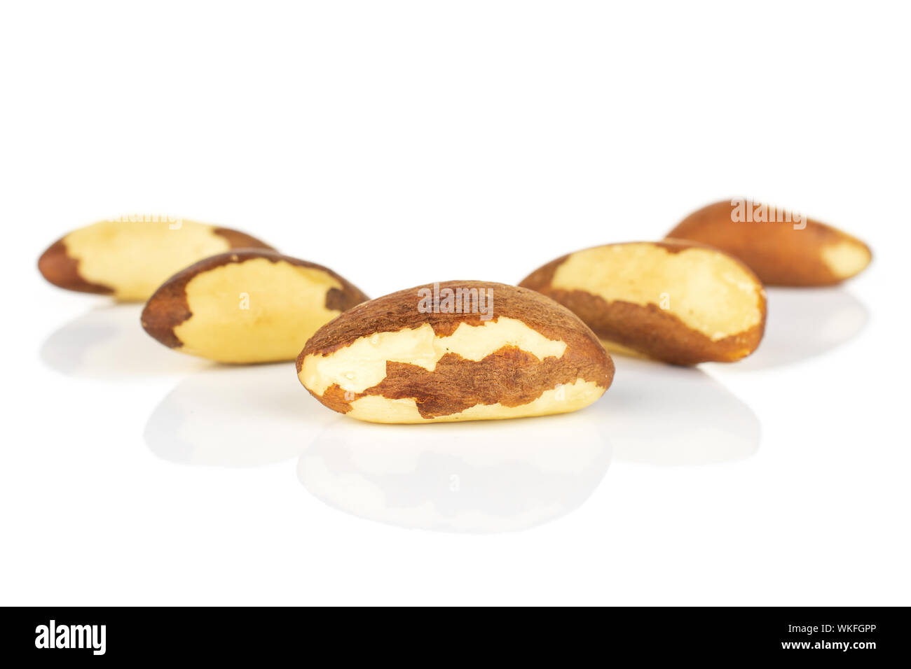 Group of five whole raw brown brazil nut isolated on white background ...