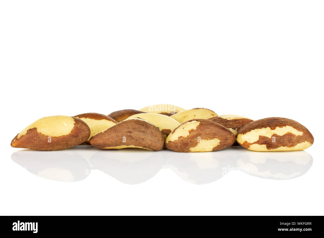 Lot of whole raw brown brazil nut isolated on white background Stock ...