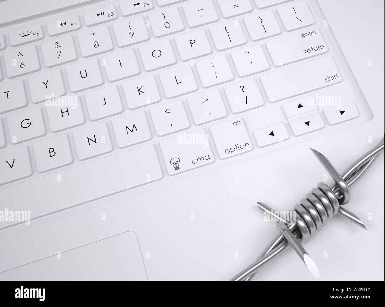 Barbed wire on the keyboard. View from above Stock Photo - Alamy