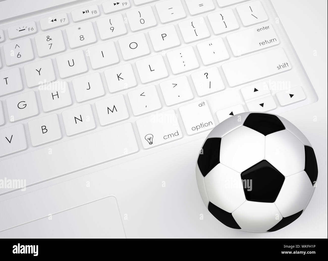 Soccer ball on the keyboard. View from above Stock Photo - Alamy