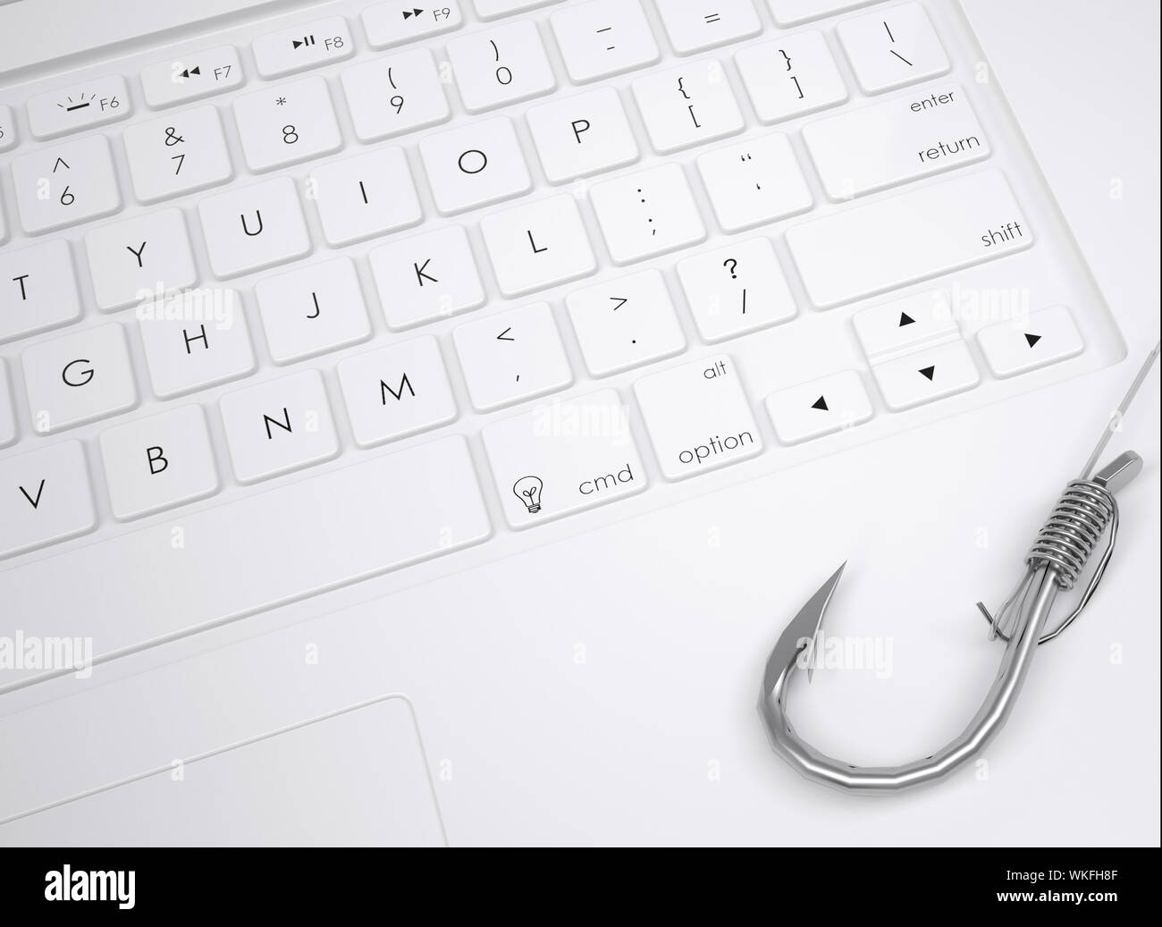 Fish hook on the keyboard. View from above Stock Photo - Alamy