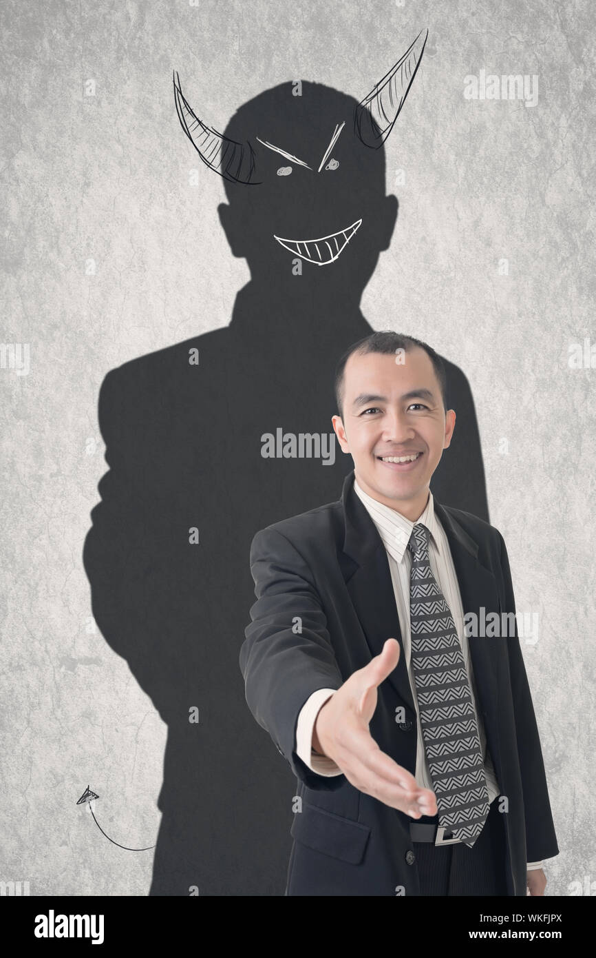 Handshake devil hi-res stock photography and images - Alamy