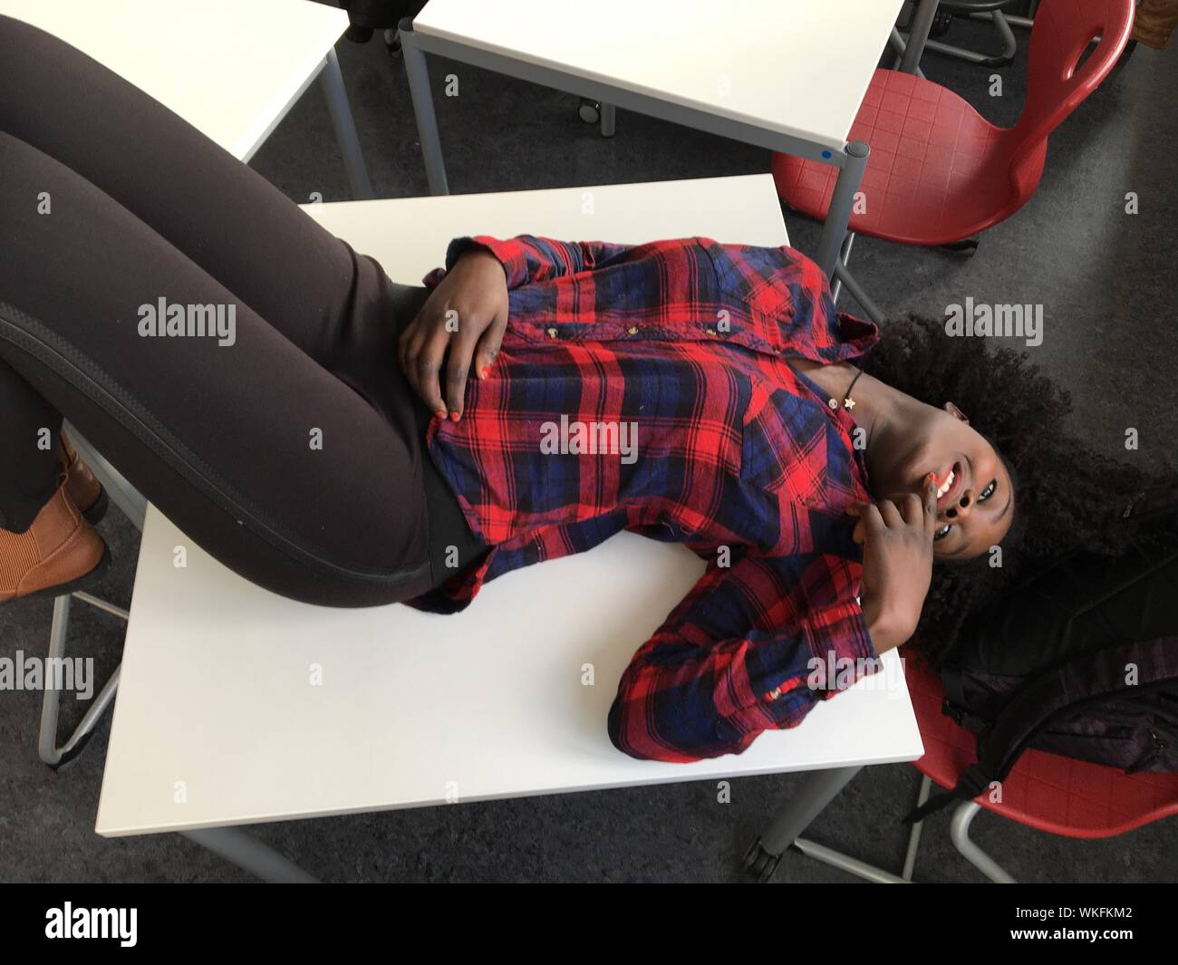 Woman lying on table hi-res stock photography and images - Alamy