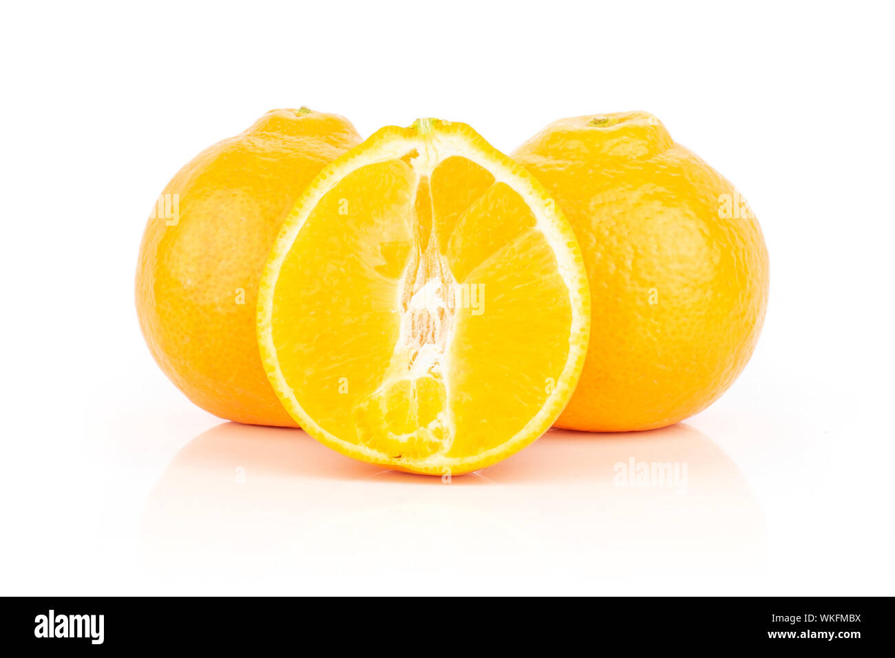 Group of two whole one half of fresh orange tangelo minneola isolated ...