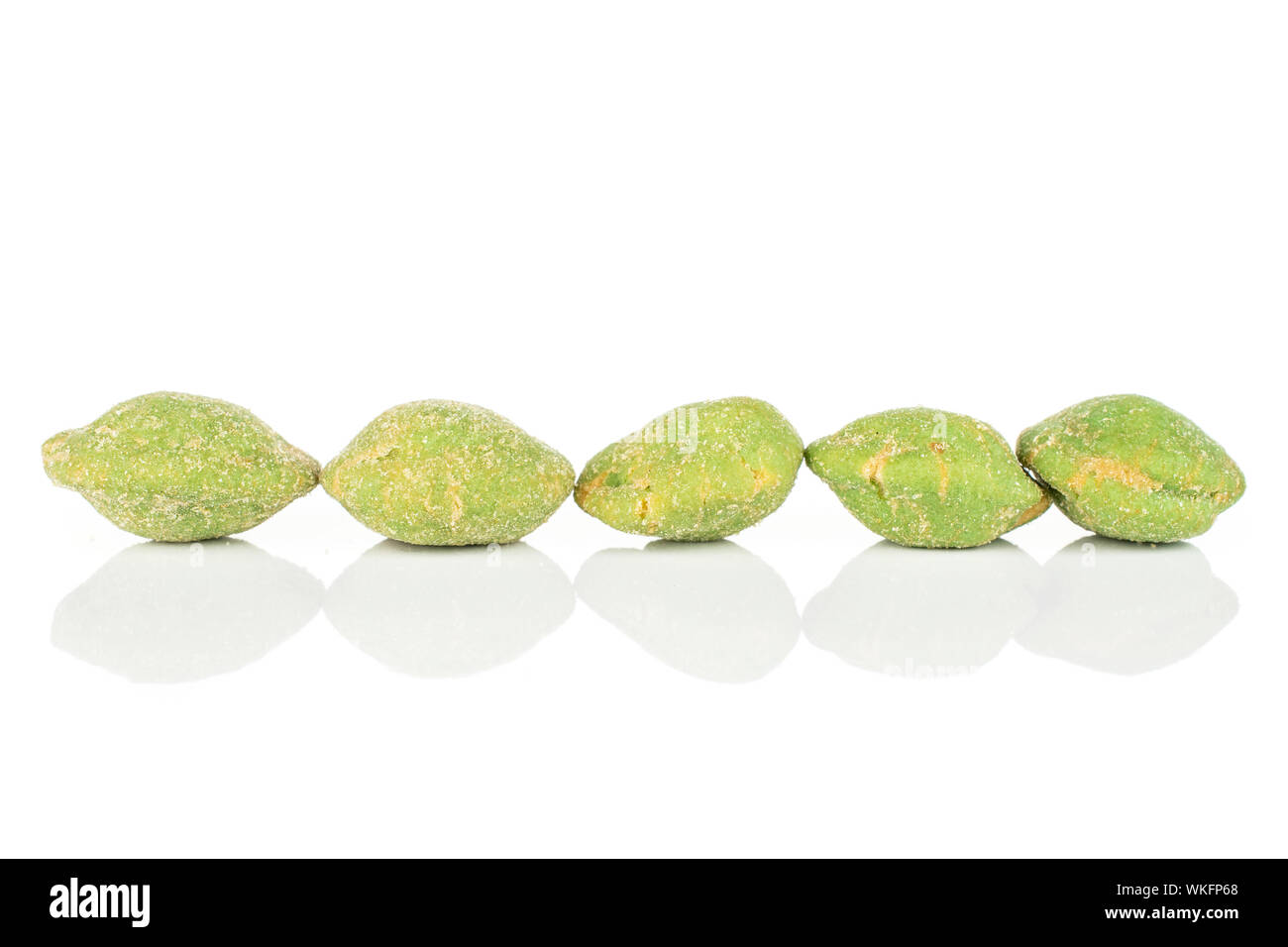 Group of five whole spicy green wasabi peanut isolated on white ...