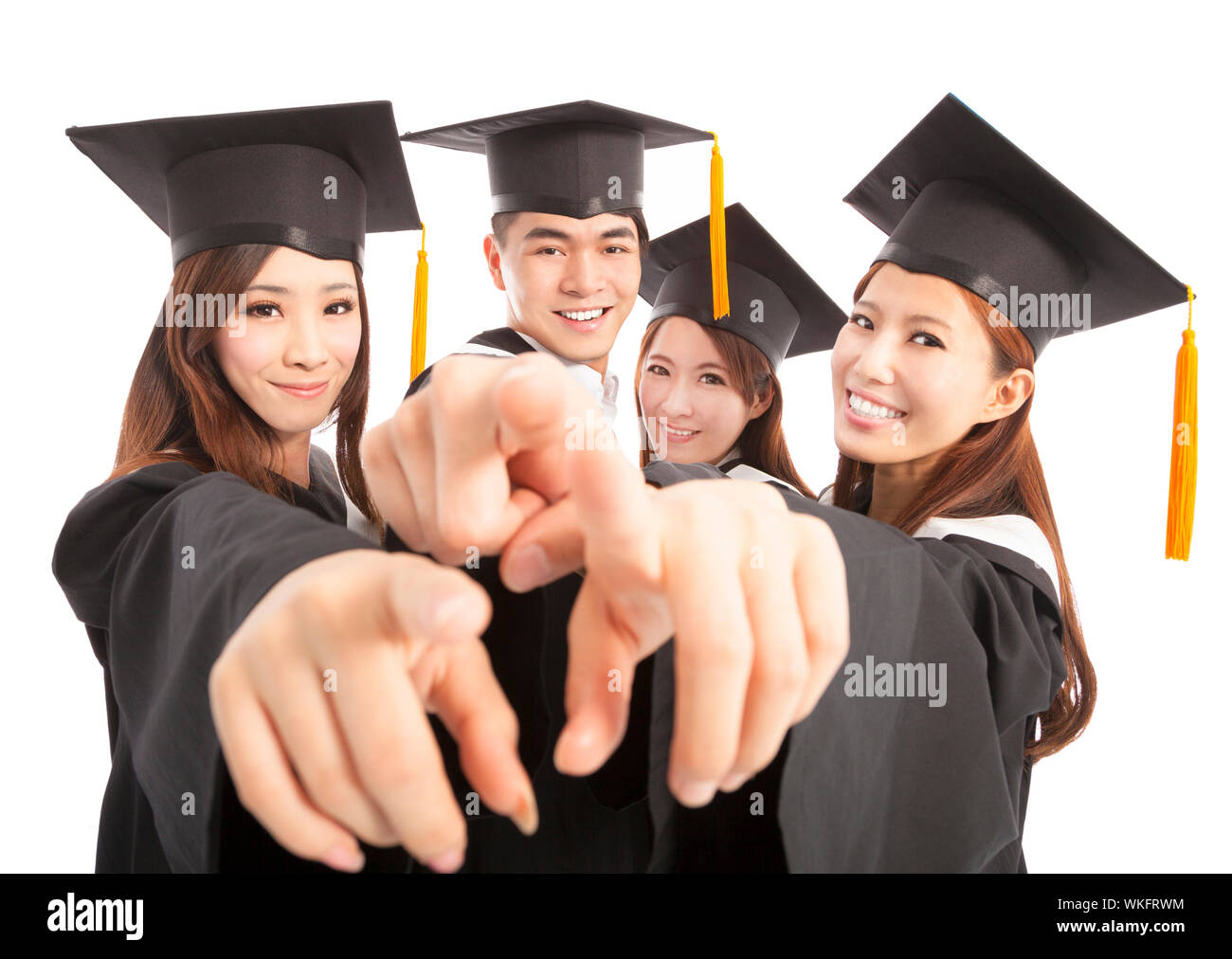 happy group graduate students point to the same direction Stock Photo ...