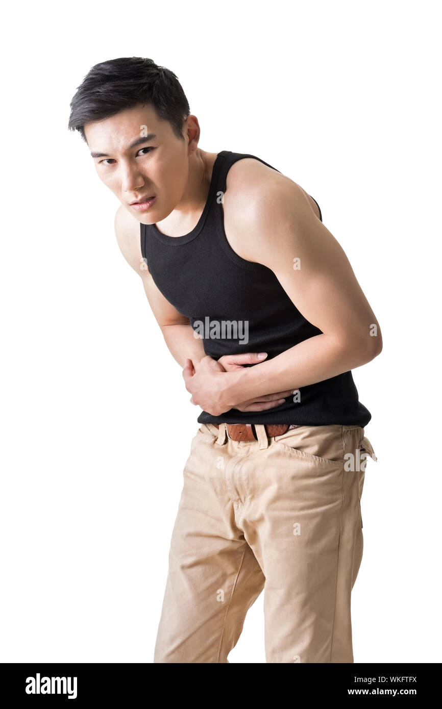 Asian young man with stomach ache, closeup portrait Stock Photo - Alamy