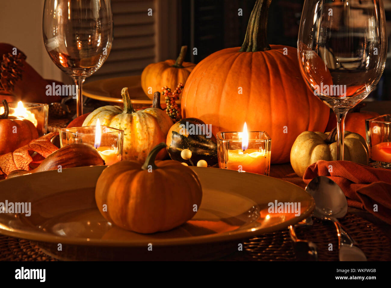 Festive autumn place settings with pumpkins and candles Stock Photo - Alamy