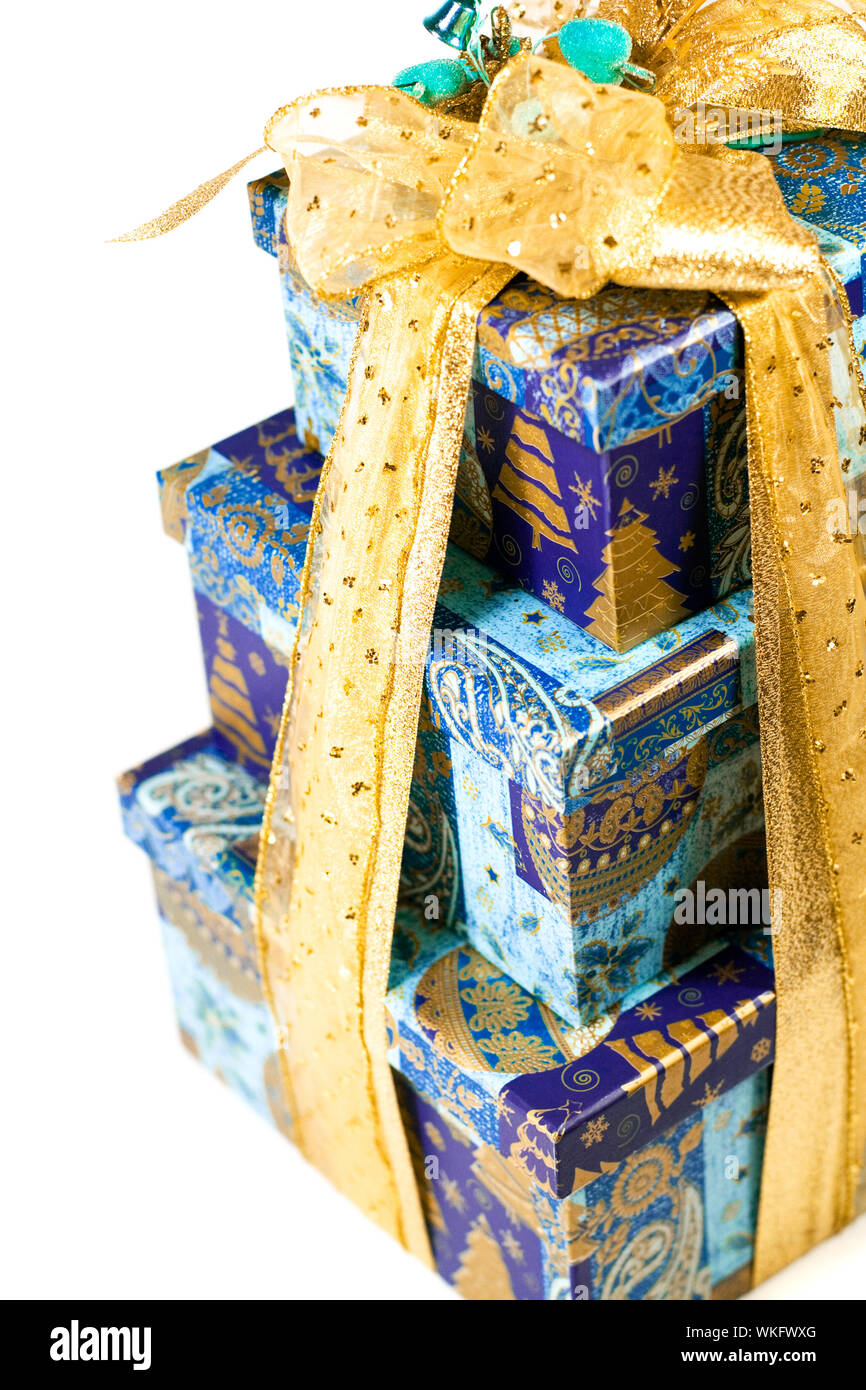 pyramid of blue gift boxes with golden bow closeup on white background ...