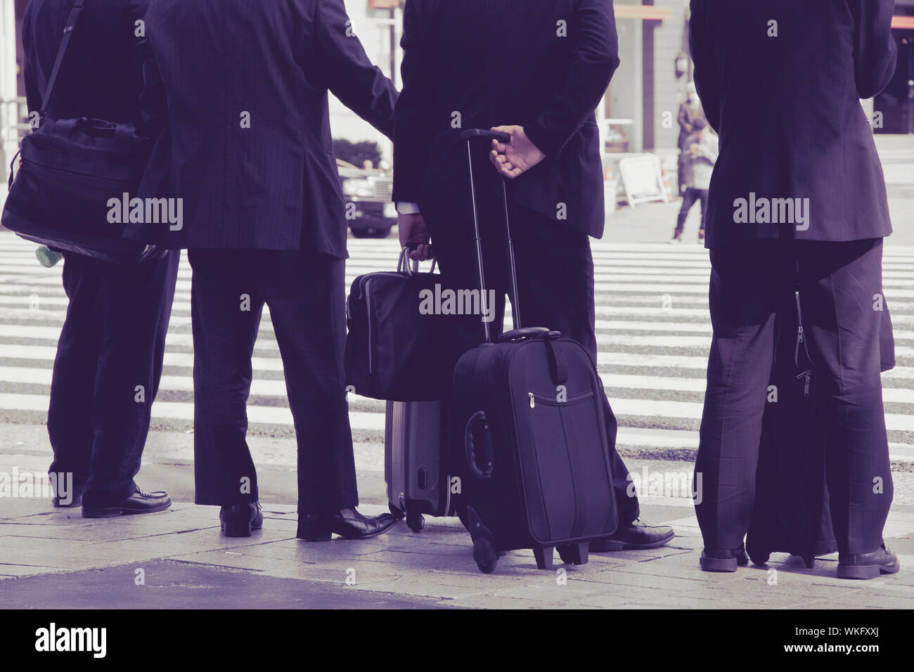 Business man waiting to cross the street Stock Photo - Alamy