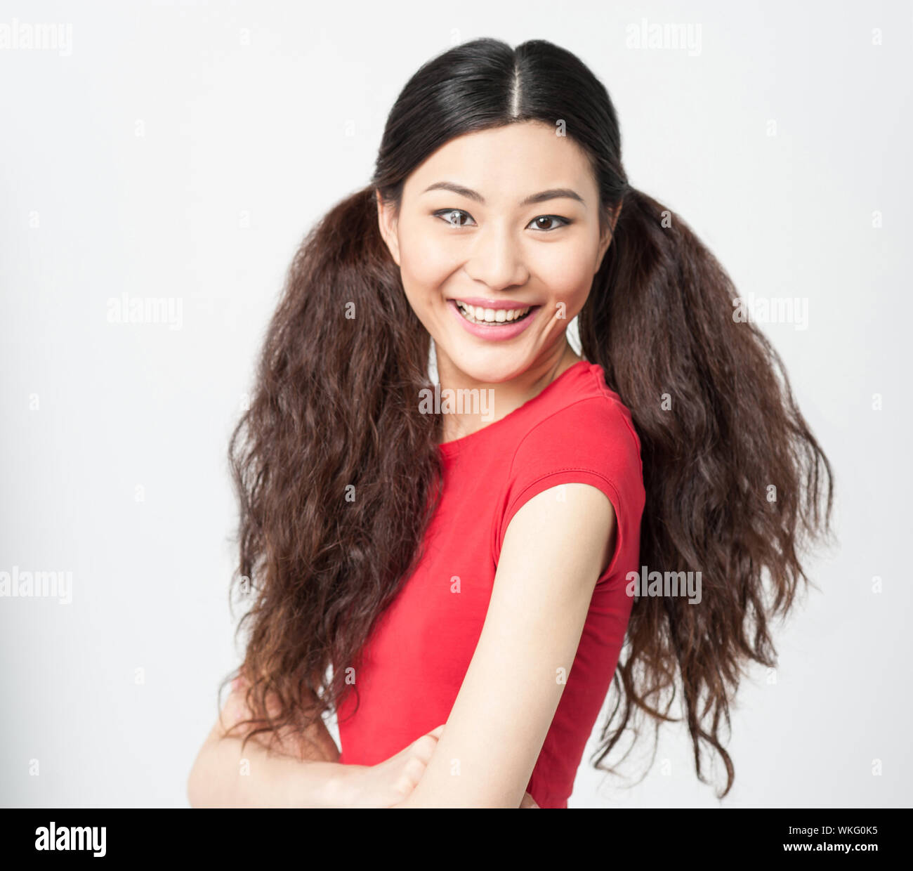 Adorable young smiling chinese girl Stock Photo - Alamy