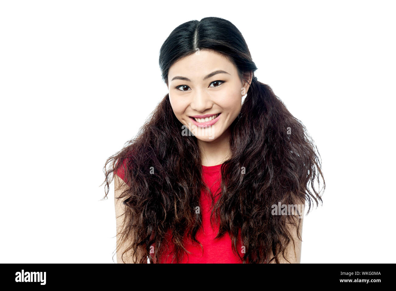 Charming girl in red top isolated over white Stock Photo - Alamy