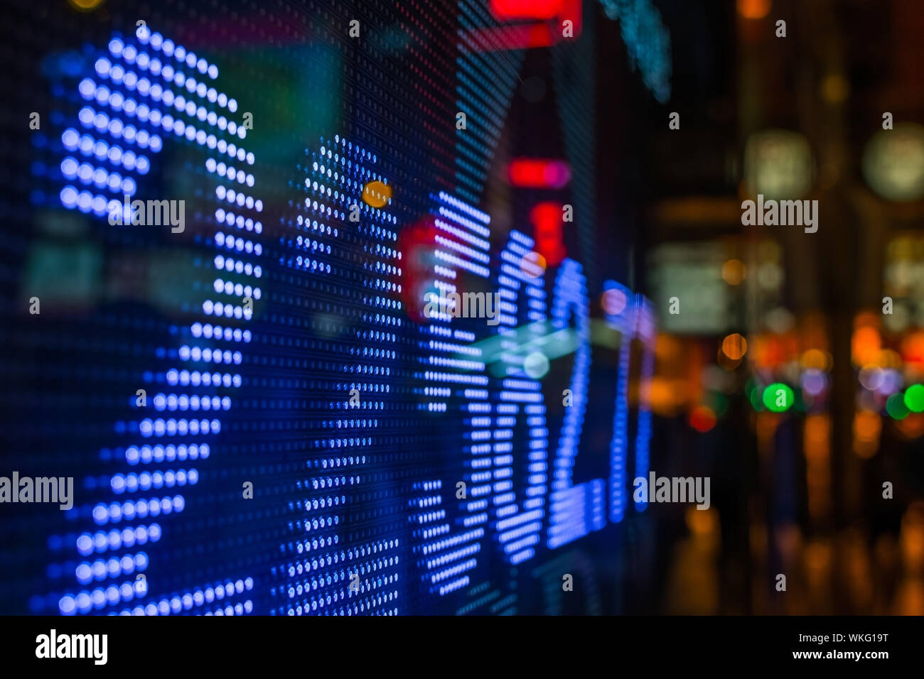Hong Kong stock market price display at street in the night Stock Photo ...