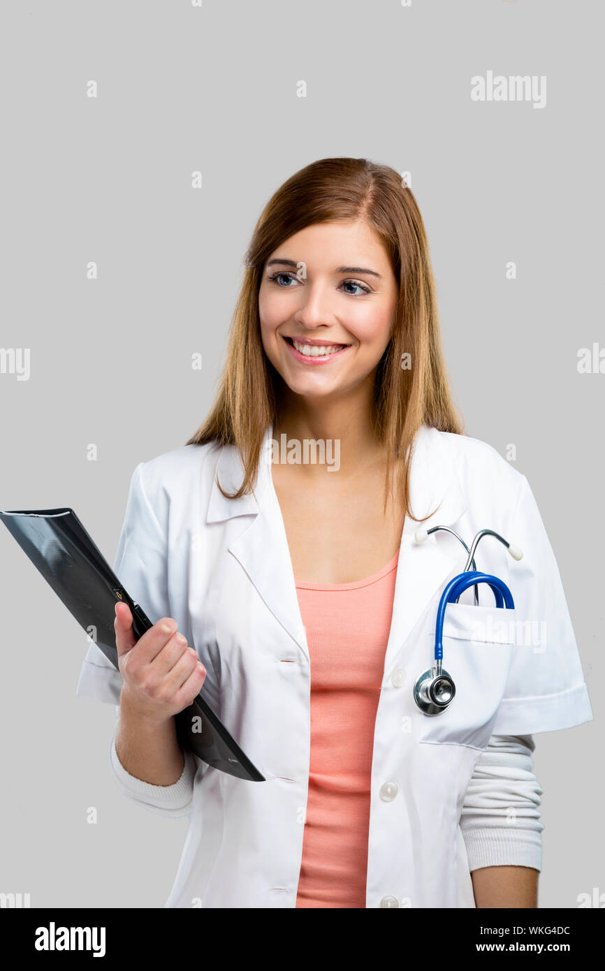 Beautiful and attractive female doctor, isolated over a white ...