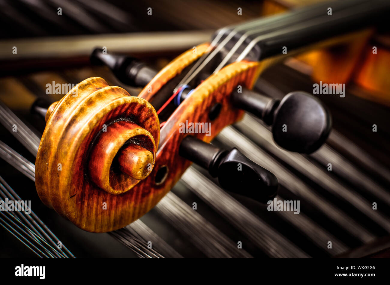 Close-up detail of violin head with string background Stock Photo - Alamy