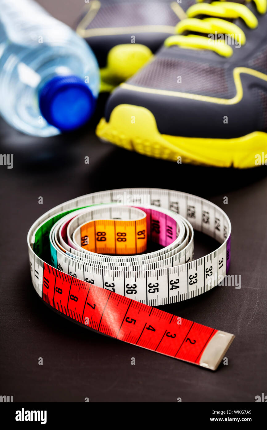 Sport shoes and measuring tape Stock Photo - Alamy