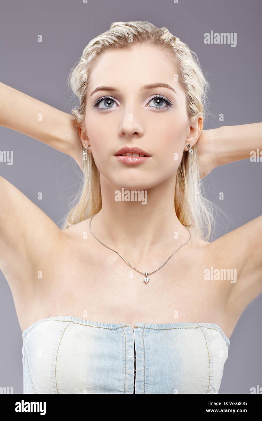 Portrait Of Beautiful Slavonic Blonde Girl Touching Her Hair Stock