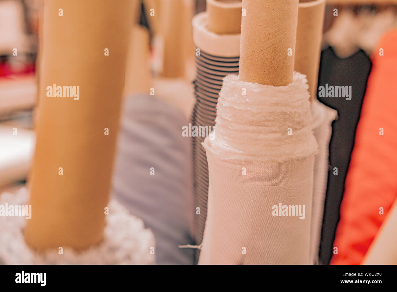 Rolls of natural high fashion fabrics and textiles. Sewing industry ...